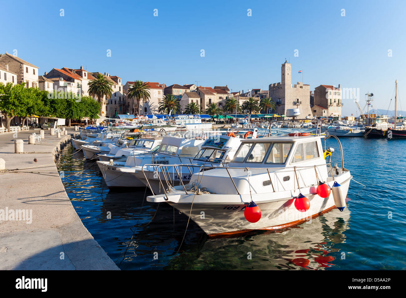 KOMIZA, CROATIA - JULY 6, 2012: Fishermans on boat in Komiza harbor on ...