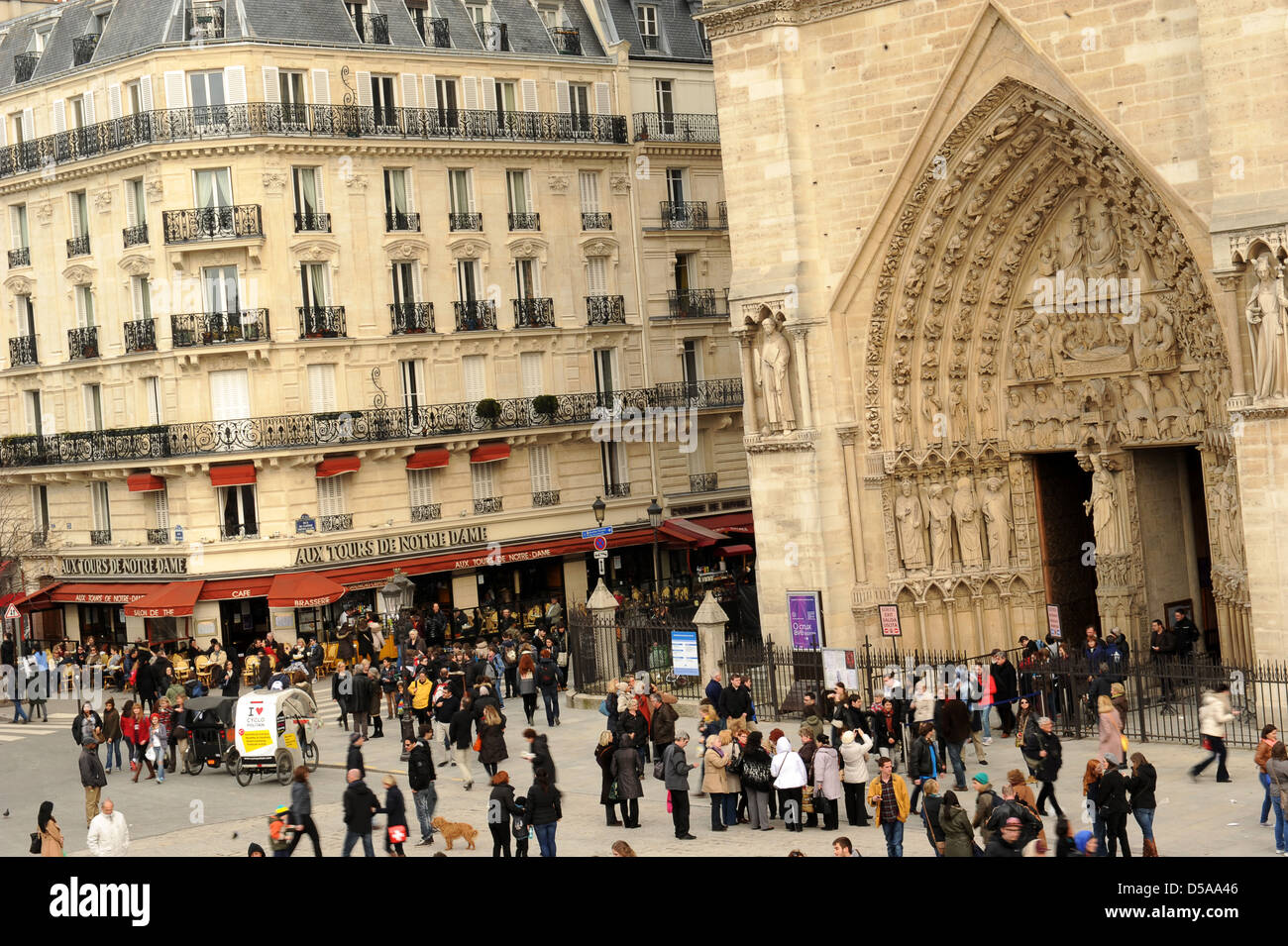 Crowded street outside the Notre Dame Paris France. tourism tourists ...