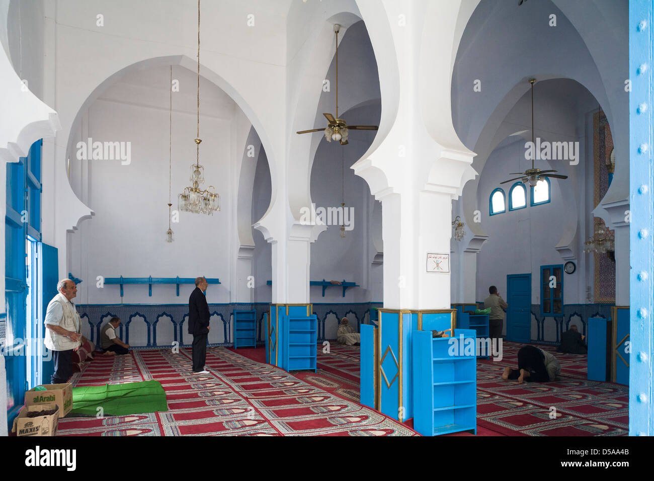 PRAYING IN THE GREAT MOSQUE INTERIOR, MOROCCO, LARACHE Stock Photo - Alamy