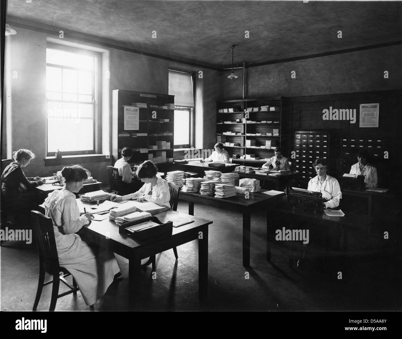 This photo from 1917 depicts food conservation work being conducted in ...