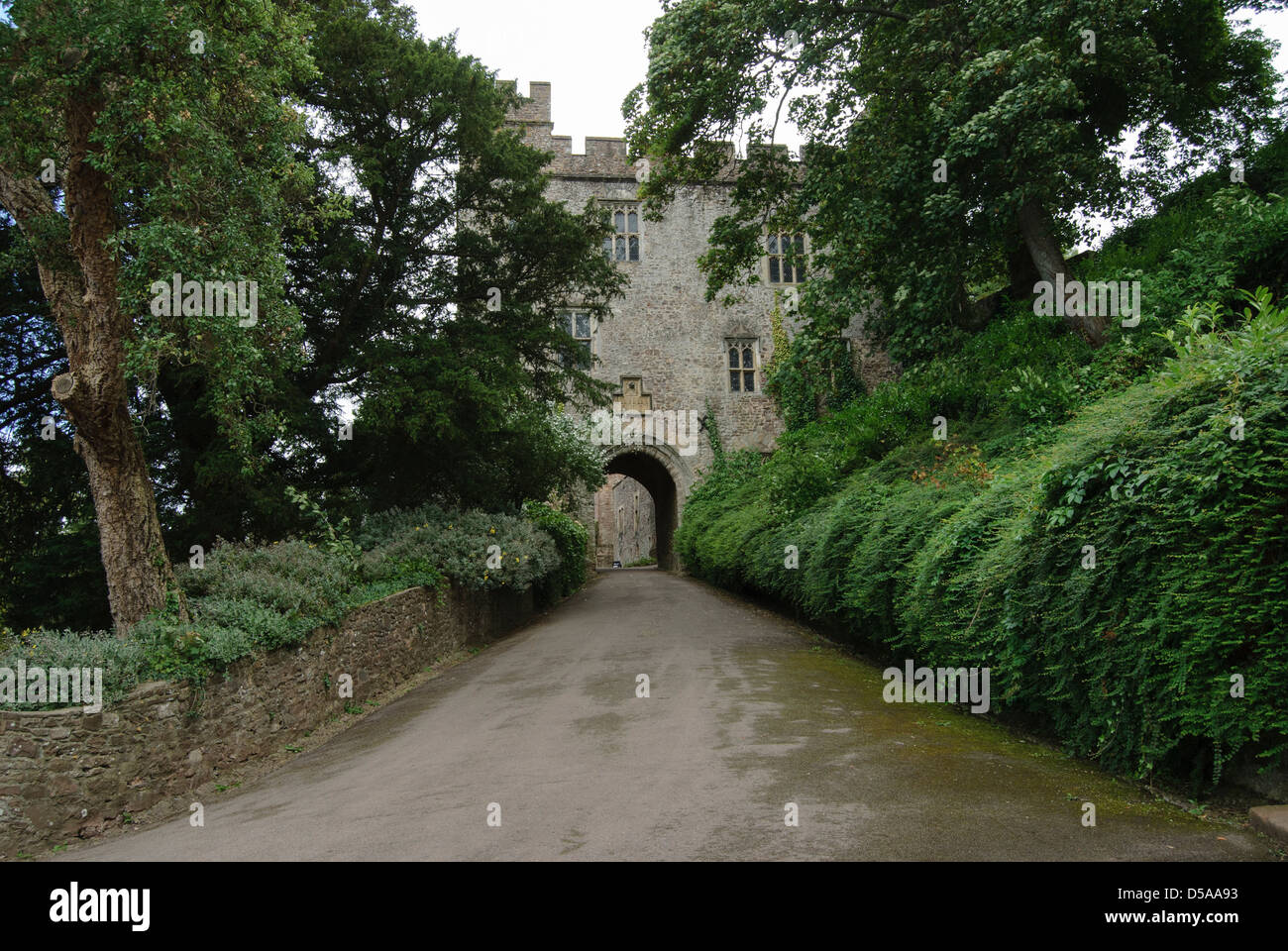 Road to the gate of Dunster Castle, Exmoor, Devon, England Stock Photo ...