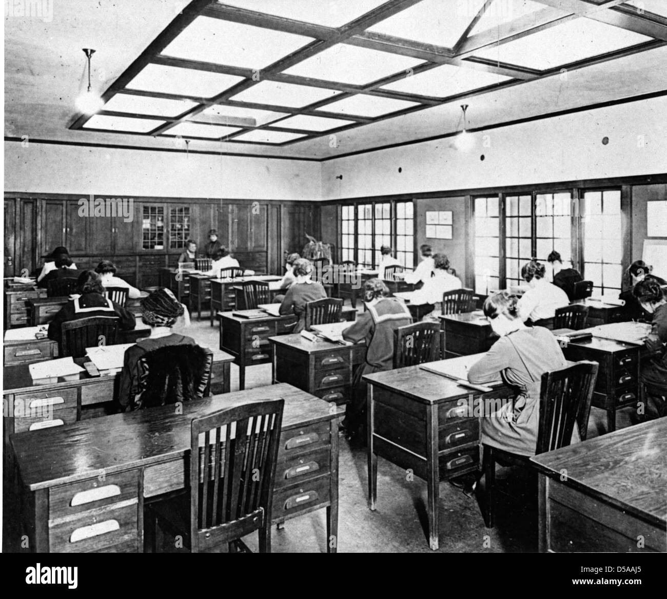 Two photographs showing a laboratory and drafting room used for house ...
