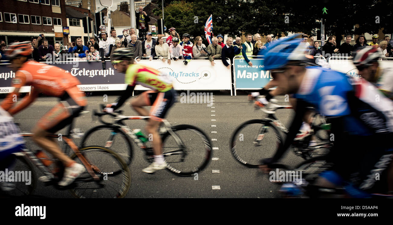 A crowd watching a cycle race Stock Photo - Alamy