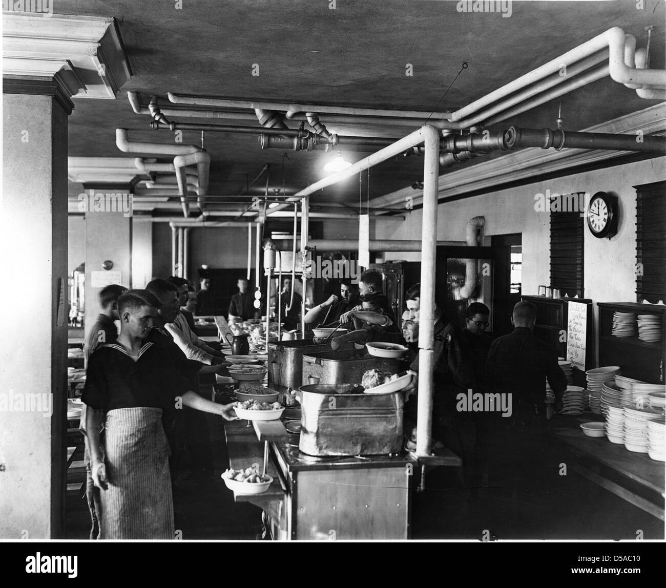 A historic photograph showing servicemen at a cafeteria counter during ...