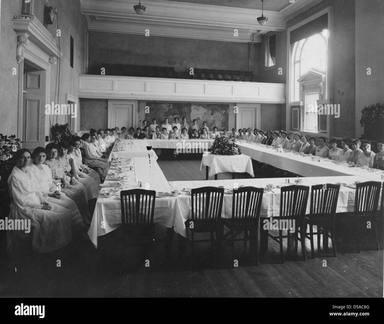 A photograph of seniors and staff gathered in the auditorium of the ...