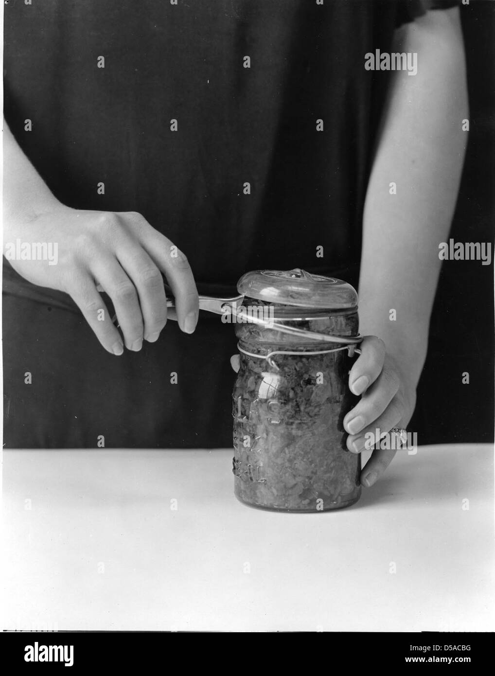 This image shows a jar lid lifter, part of a pictorial series from the ...