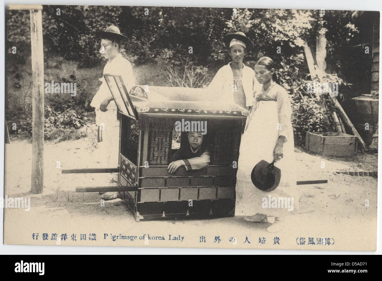A photograph showing a Korean woman on a pilgrimage, dressed in ...