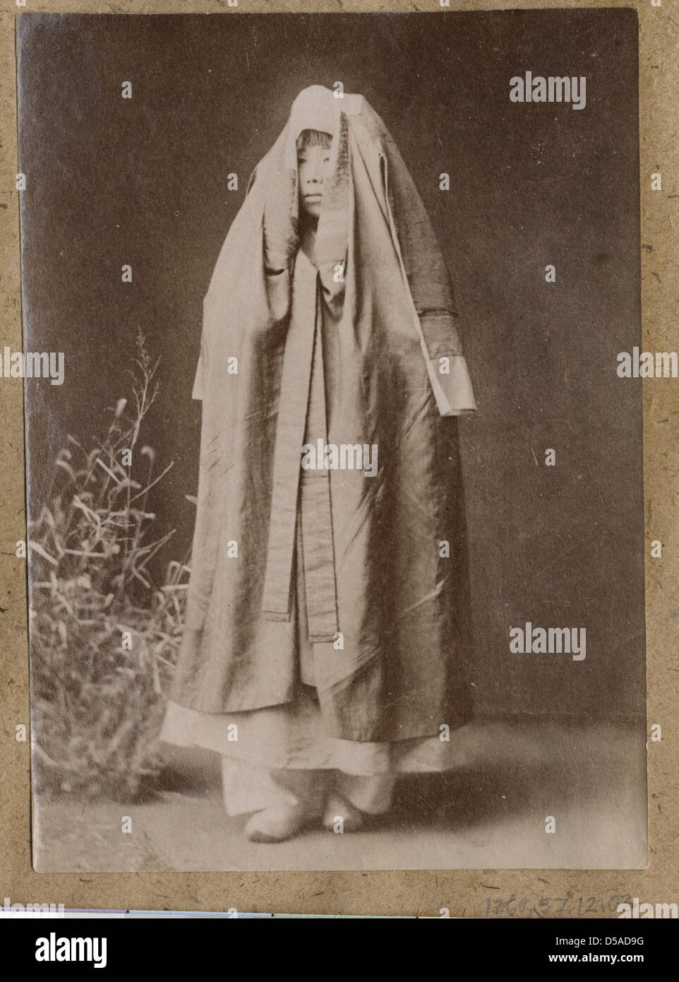 Wrapped cloak hi-res stock photography and images - Alamy