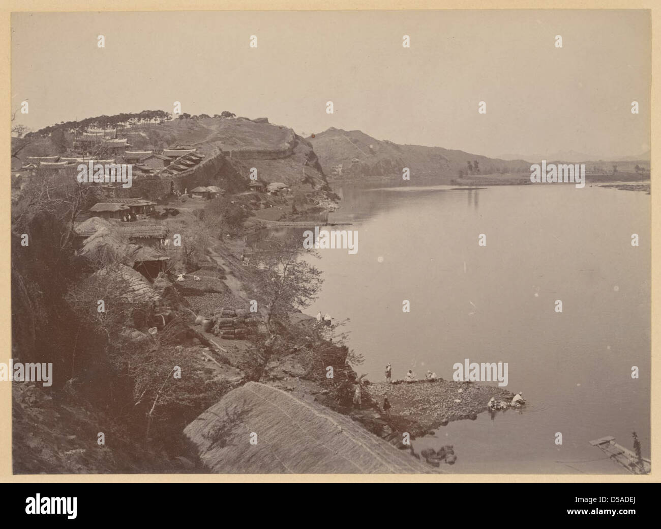 A photograph of the Yalu River and the surrounding landscapes in North ...