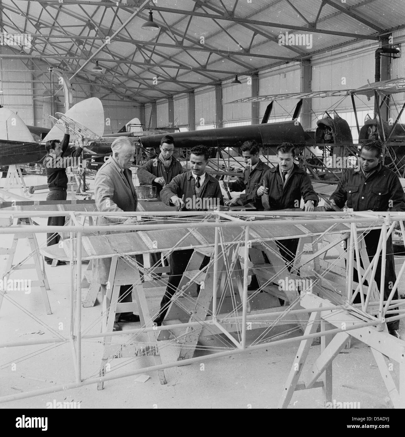 Historical 1960s. Flying. Group of pilot cadets being shown the frame ...