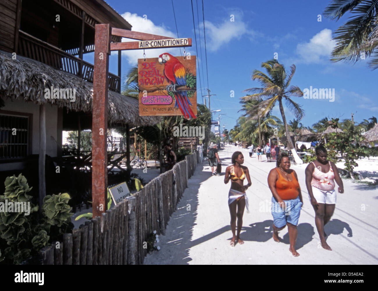 Local beauties walk down the main drag in Caye Caulker, Belize Stock ...