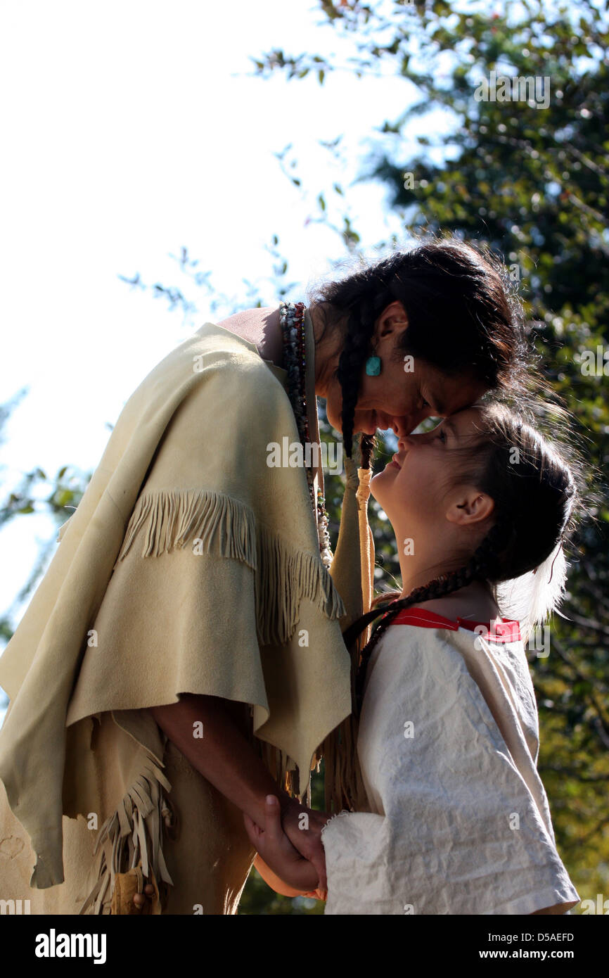 A Native American Indian Lakota Sioux mother looking into the eyes of ...