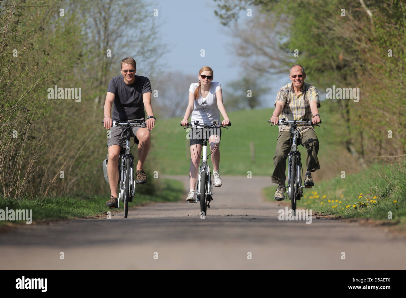 Oeversee, Germany, cyclists on a road with a series of electric ...