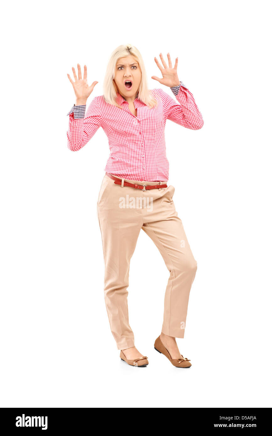 Full length portrait of a scared woman isolated on white background ...