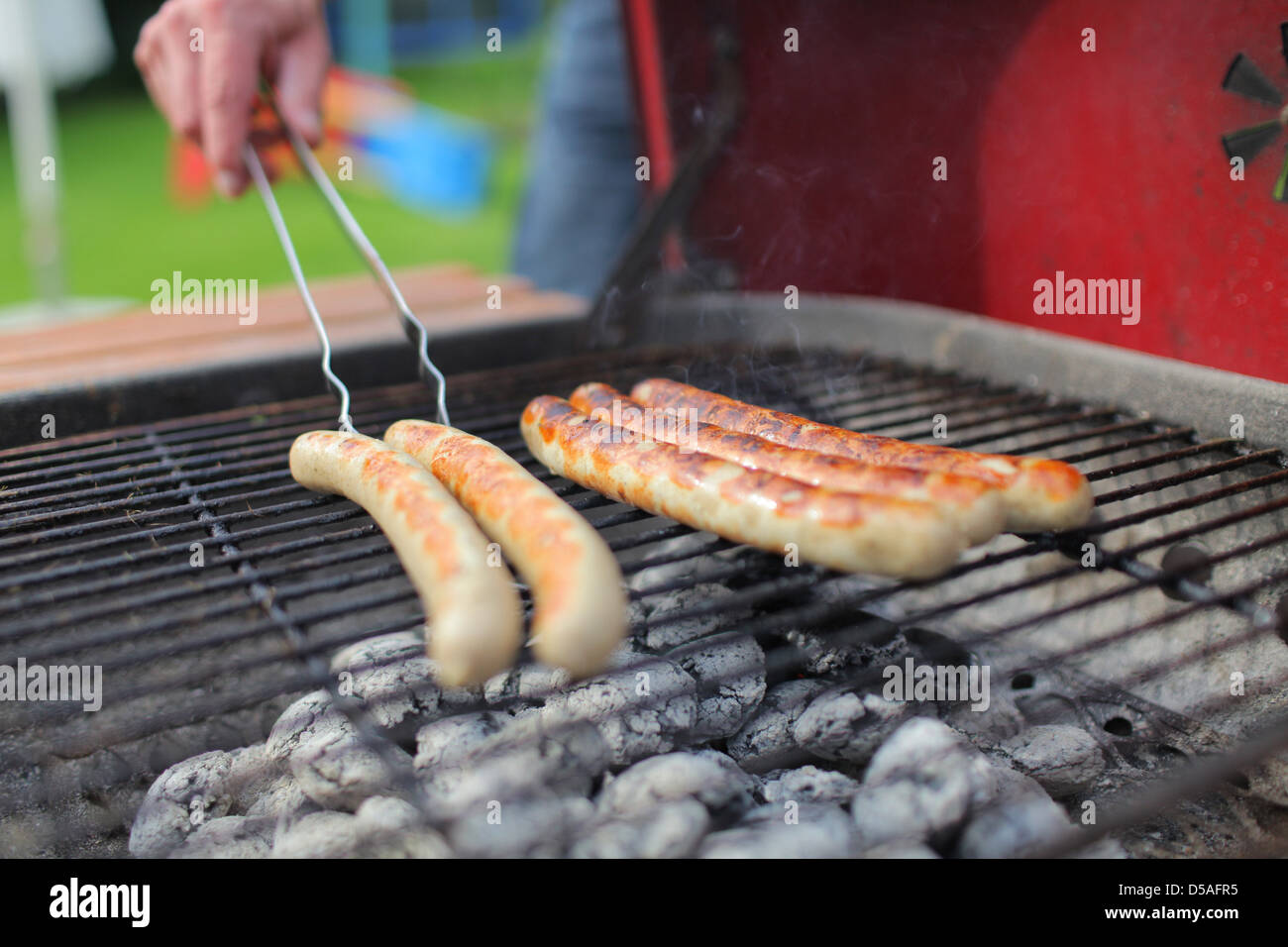 Handewitt, Germany, sausages are on a charcoal grill Stock Photo - Alamy