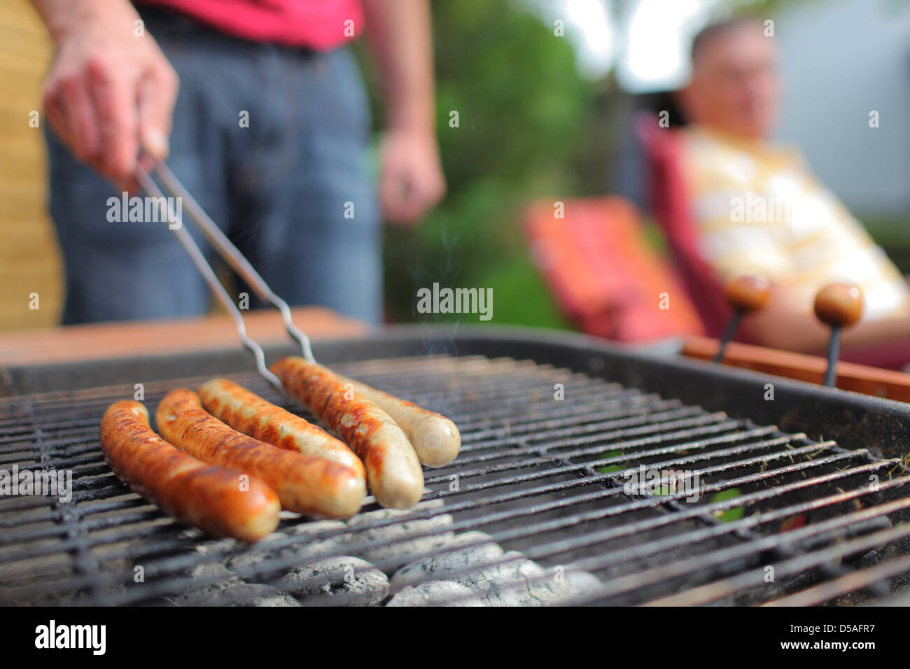 Handewitt, Germany, sausages are on a charcoal grill Stock Photo - Alamy