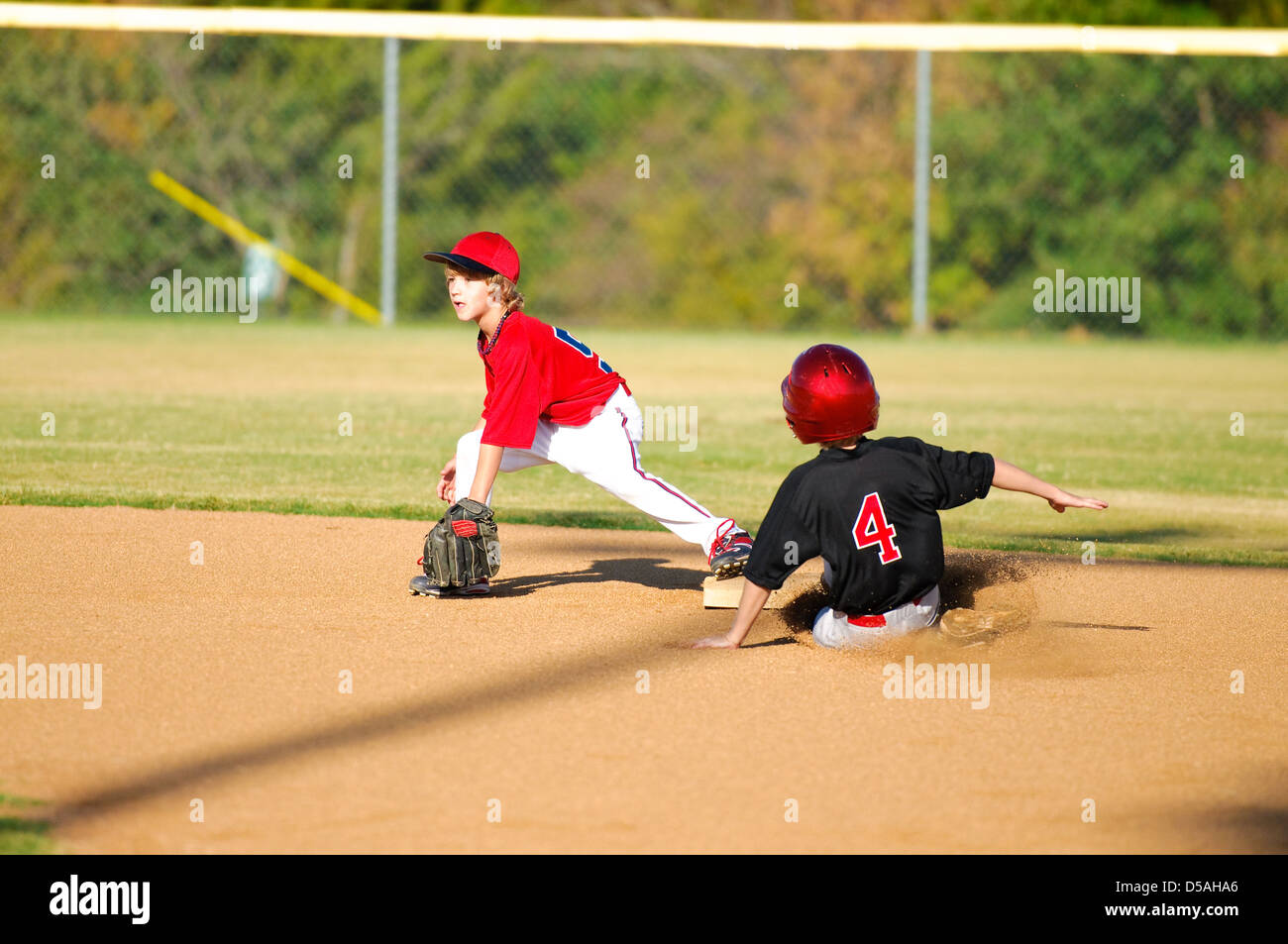 Little league baseball player getting an out at second base Stock Photo ...