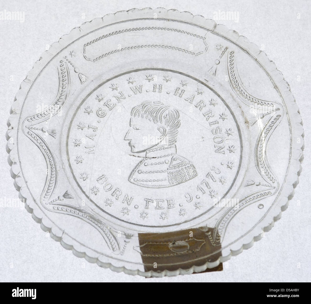 This glass portrait cup plate from around 1840 features a profile of ...