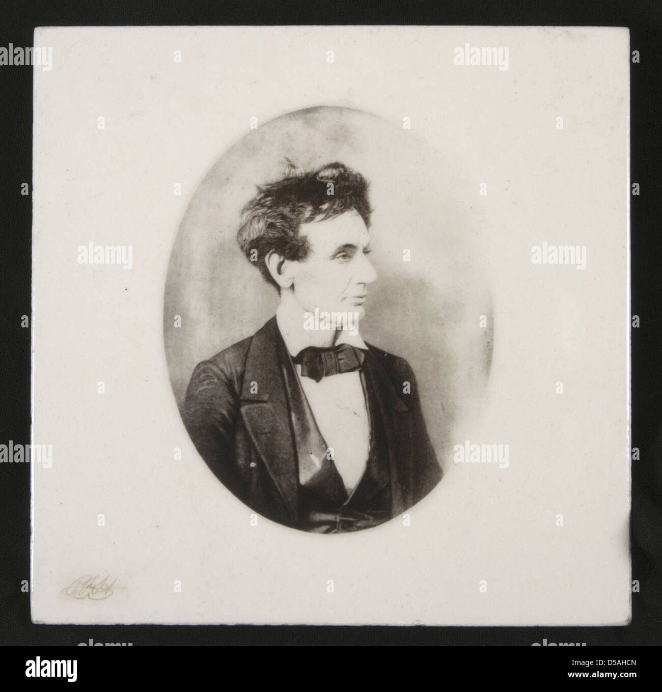 A ceramic portrait tile bust of Abraham Lincoln, commemorating his ...