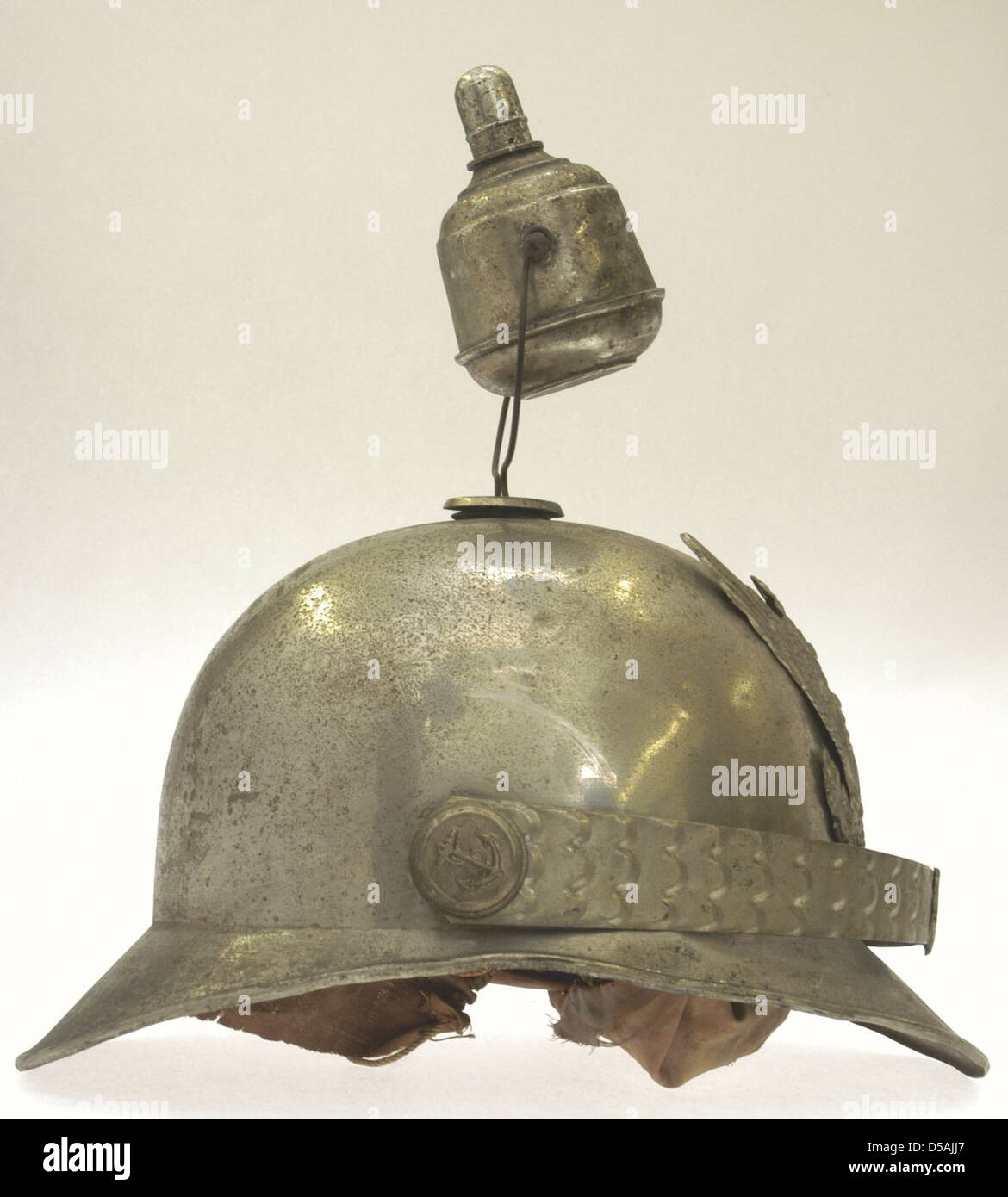 This helmet from around 1892 is designed to hold a torch, symbolizing ...