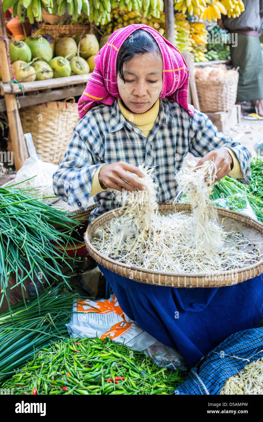 A local market in Bagan. Woman vendor selling vegetables Stock Photo ...