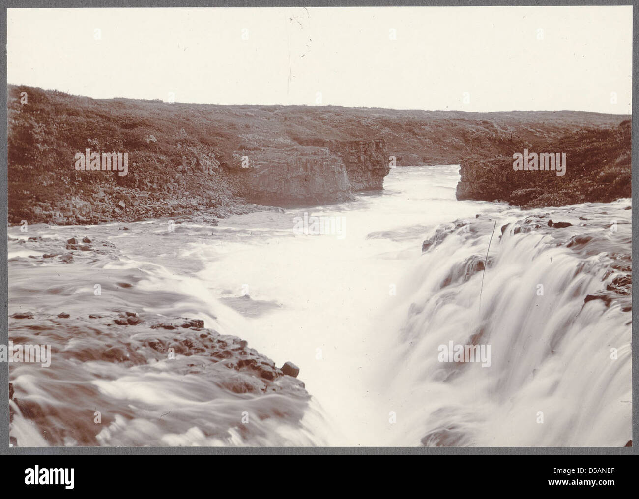 A historical photograph depicting a bridge with a view of the ...