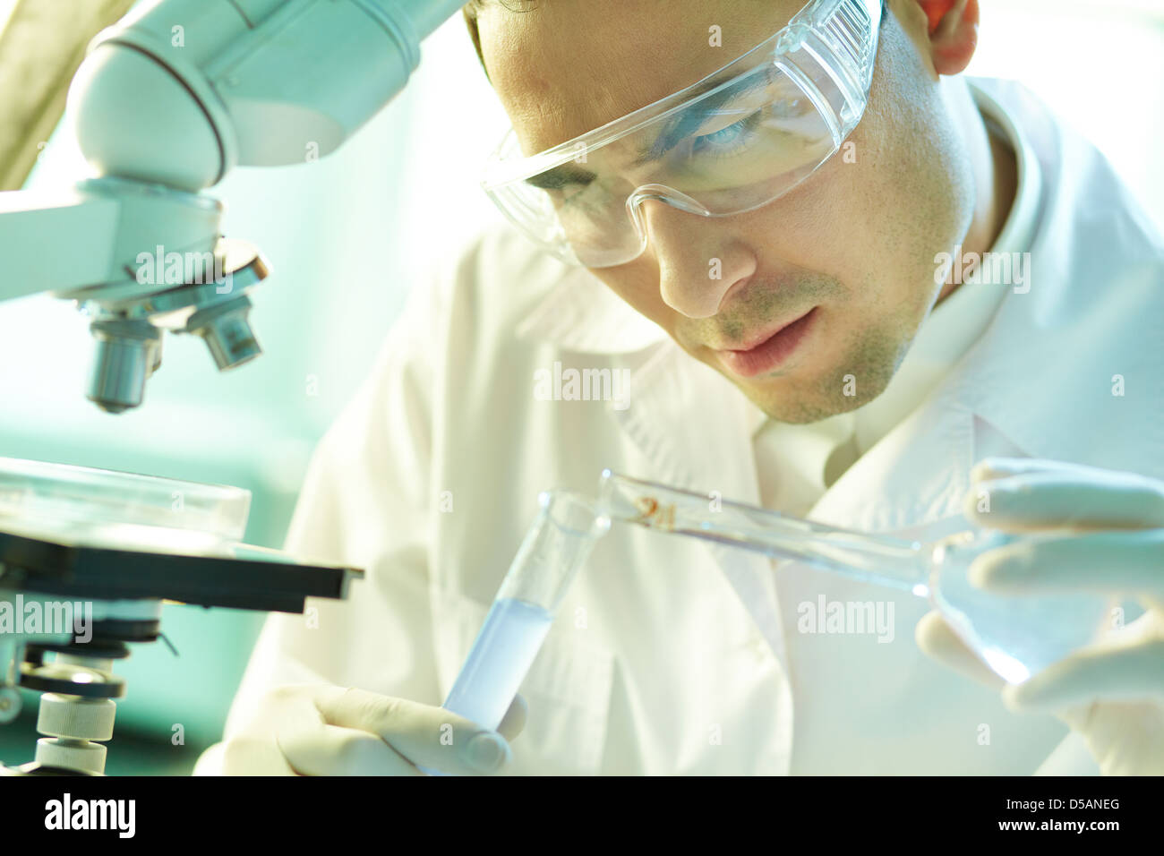 Close up male scientist experimenting hi-res stock photography and ...