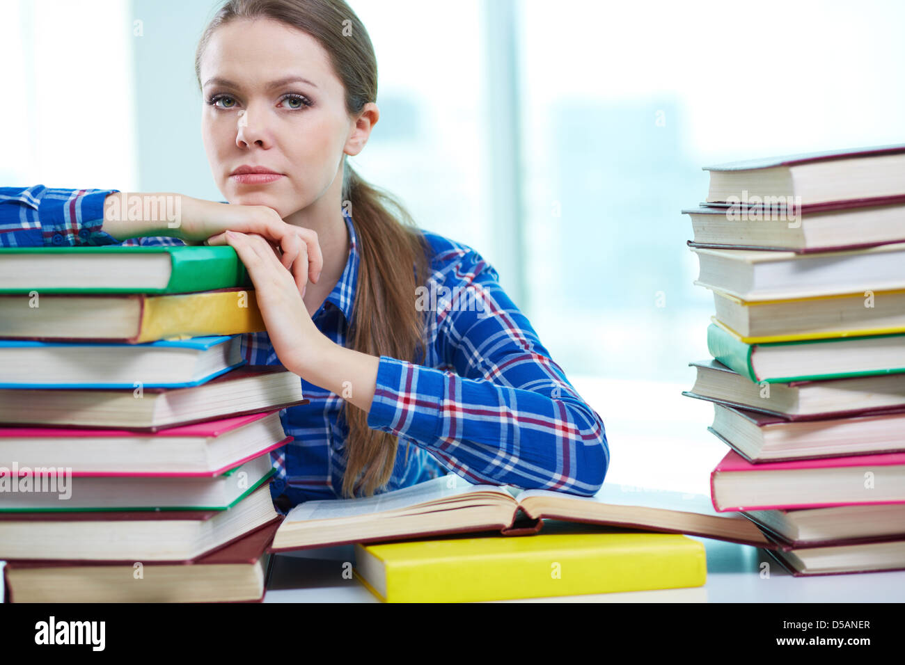 Portrait of a serious female student preparing for her exams Stock ...