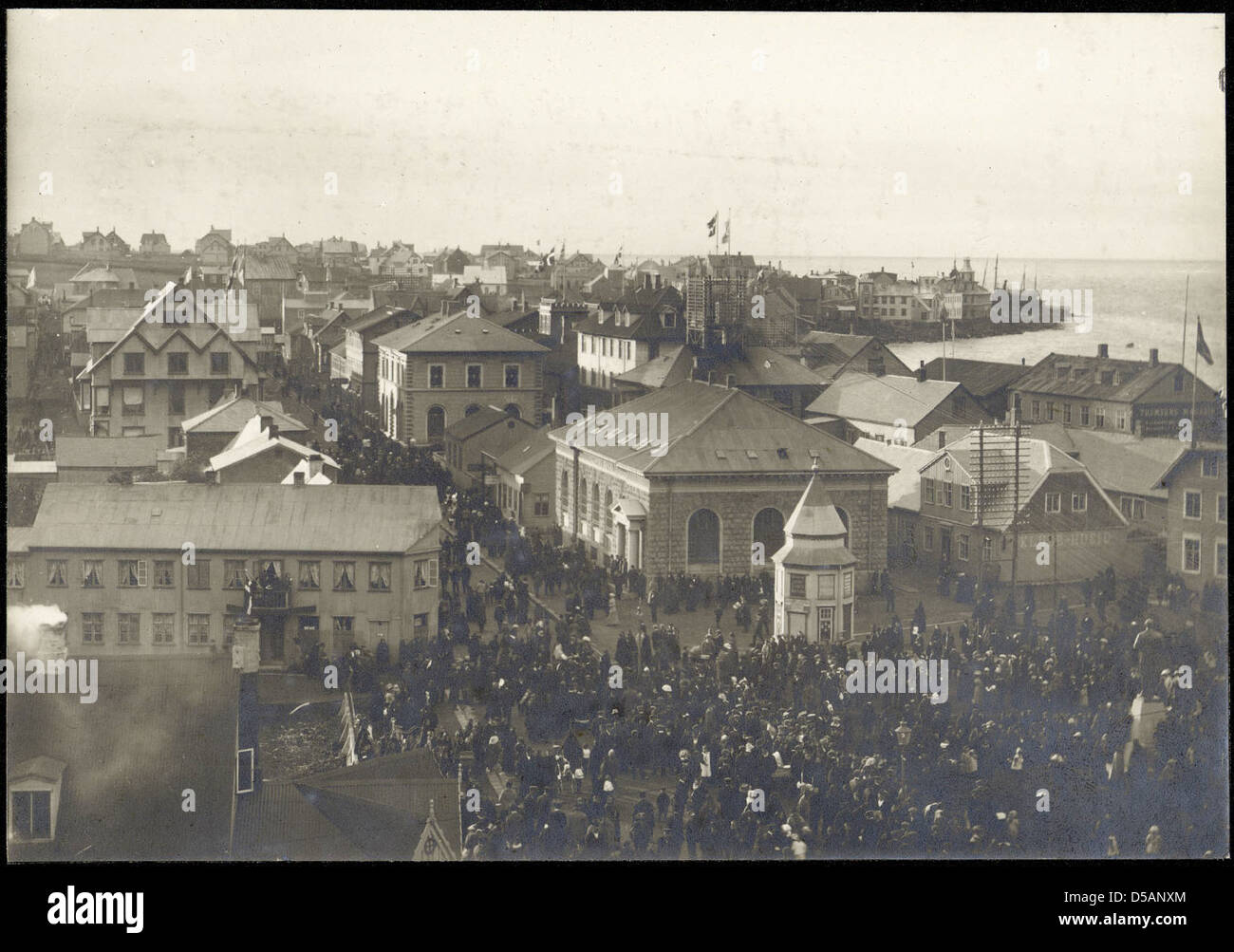A crowd in Reykjavik, Iceland, captured in a historical photograph ...