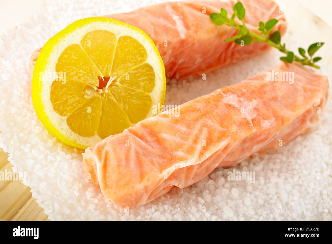 Frozen salmon fillet with lemon Stock Photo - Alamy