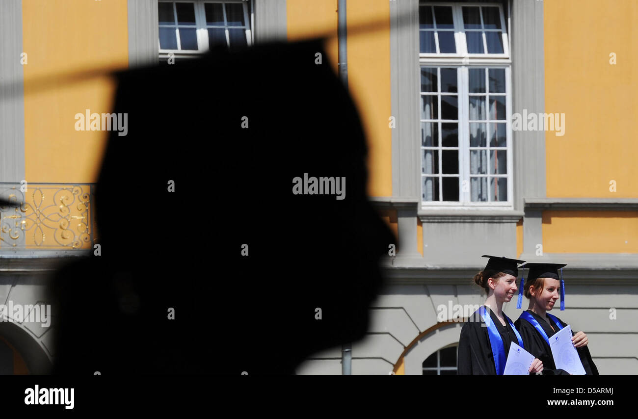 Degree holders dressed in caps and gowns of the Rheinischen Friedrich ...