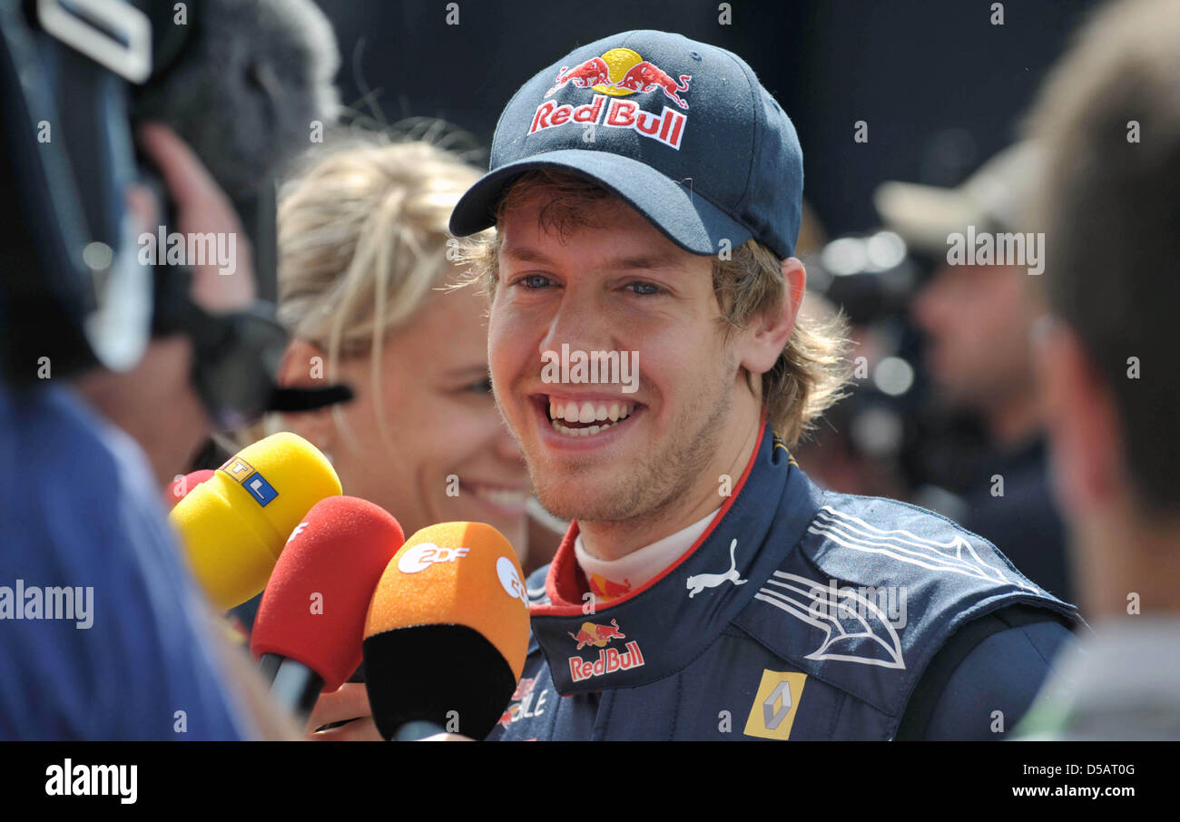 The German race driver Sebastian Vettel from the 'Red Bull' team gives ...