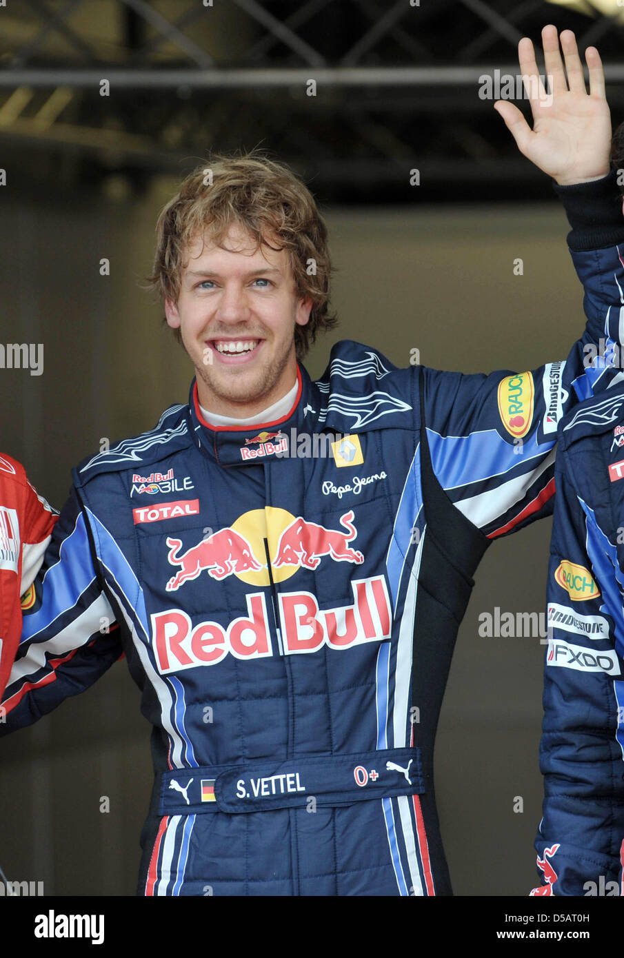 The German race driver Sebastian Vettel from the 'Red Bull' team cheers ...