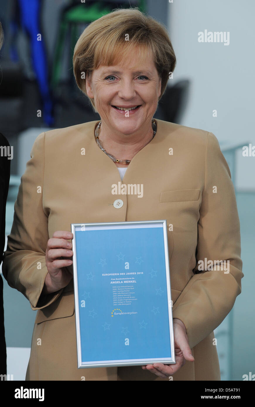 German Chancellor Angela Merkel smiles withe her award 'European of the ...