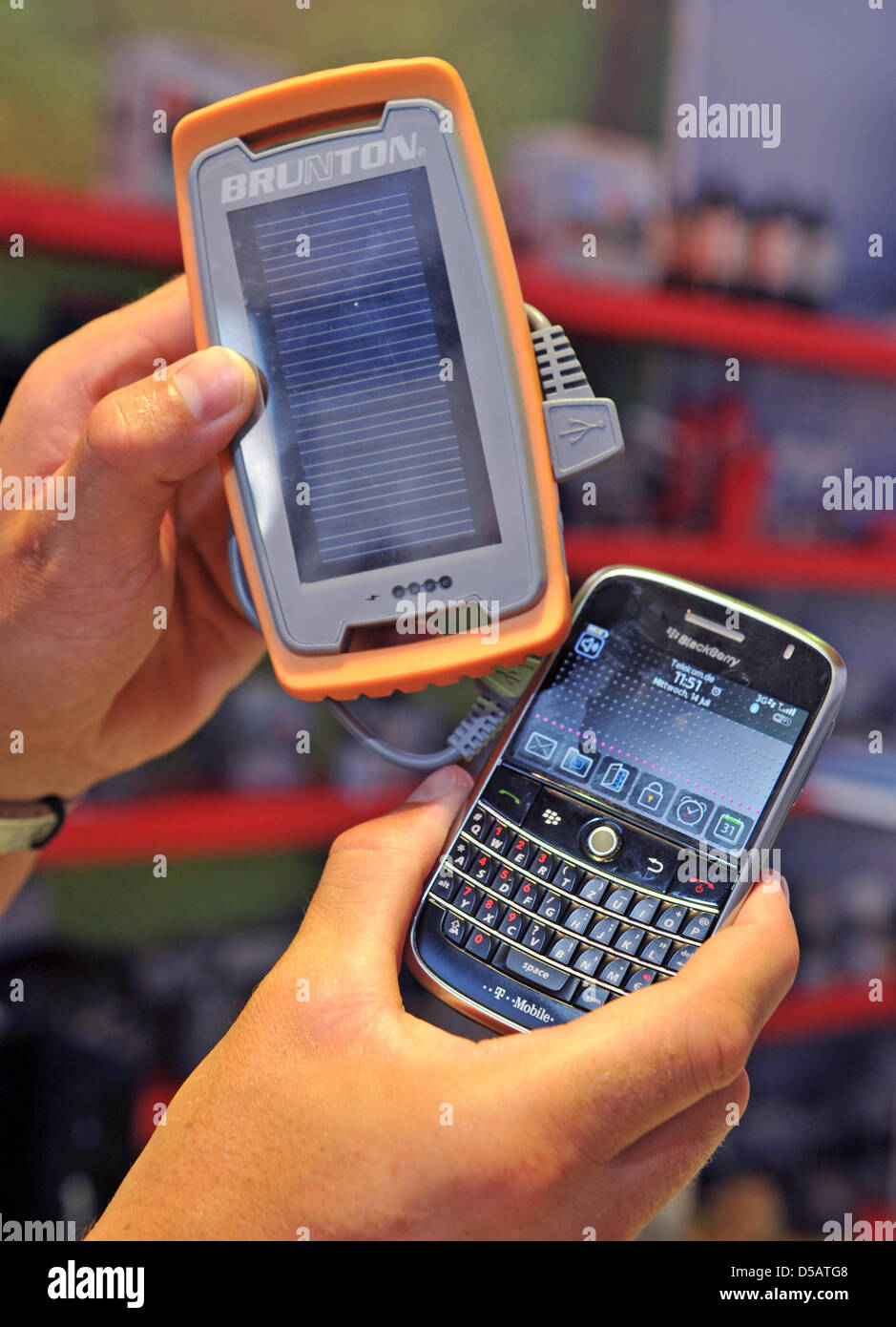 Paul Rosenquist of US company Brunton presents a solar recharging ...