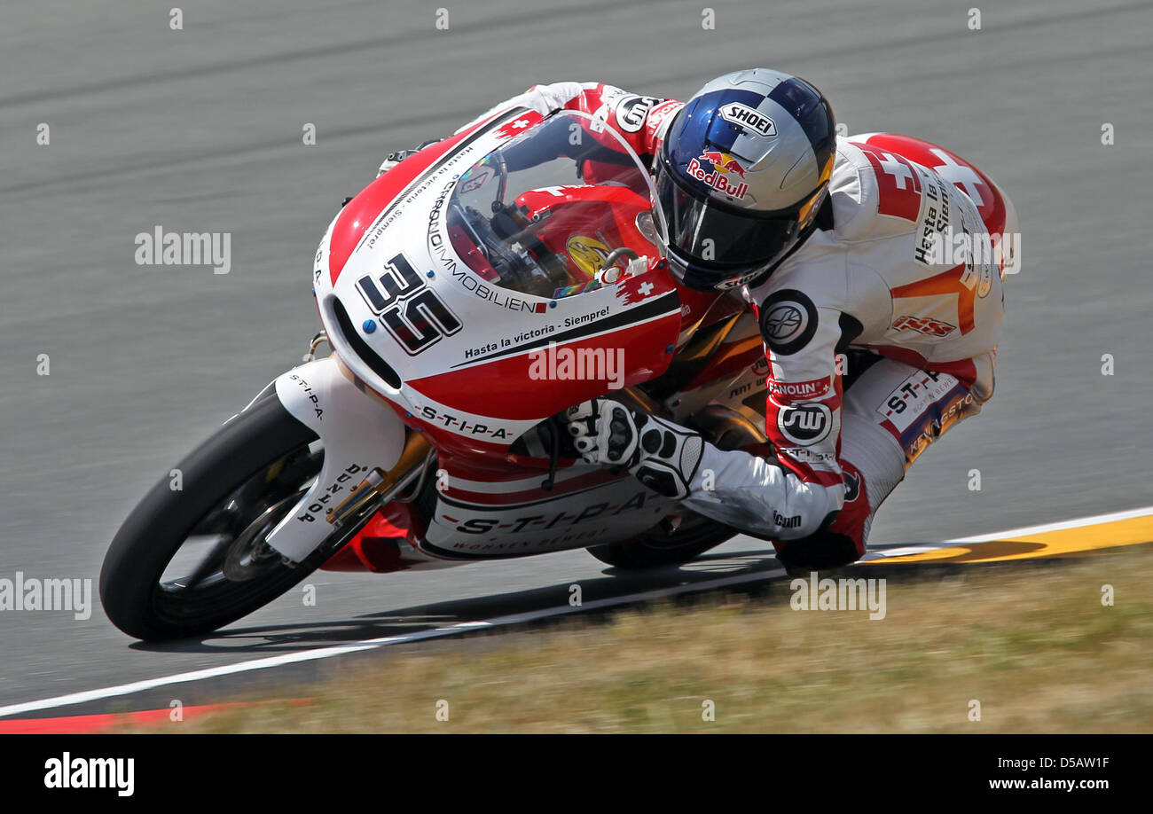 The Swiss pilot, Randy Krummenacher steers his motorcycle along the ...