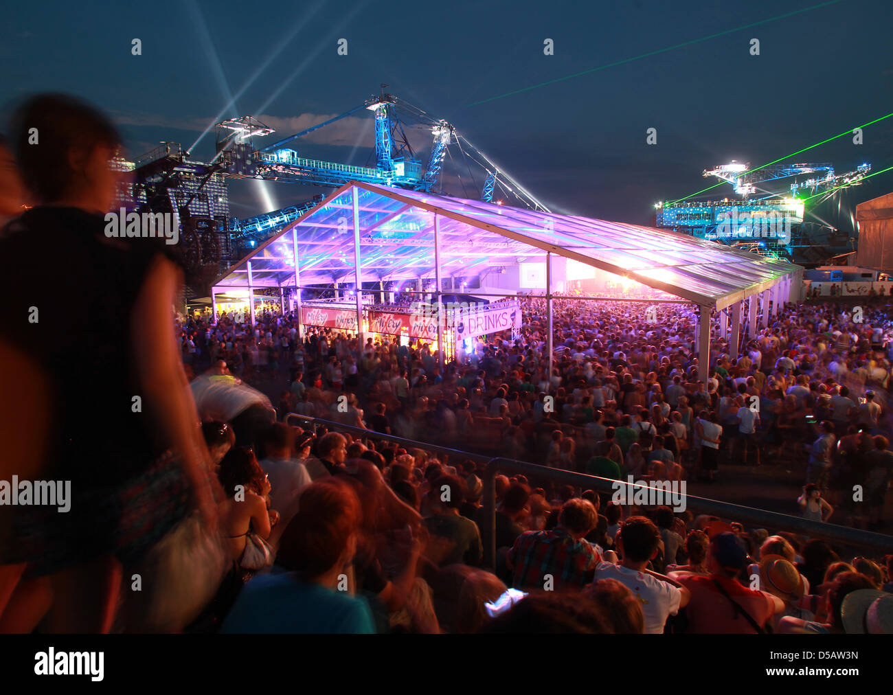Visitors to 'Melt!' festival in Ferropolis in Grafenhainichen, Germany ...