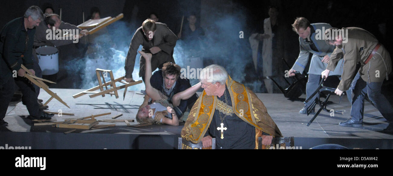 German actors Peter Striebeck (C) rehearses a scene of 'Devil, God and ...
