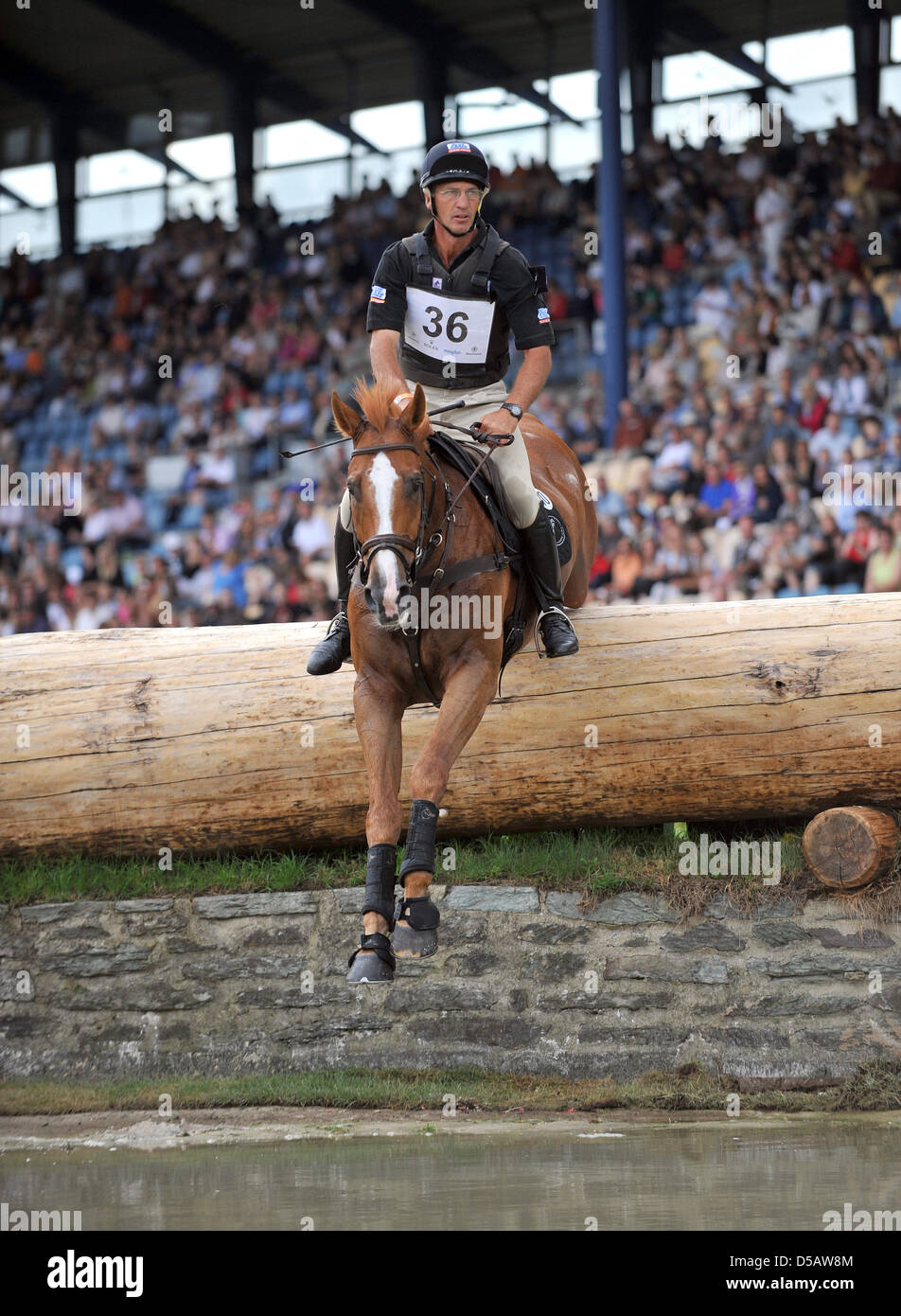 New Zealand's Andrew Nicholson and his horse 'Nereo' take an obstacle ...