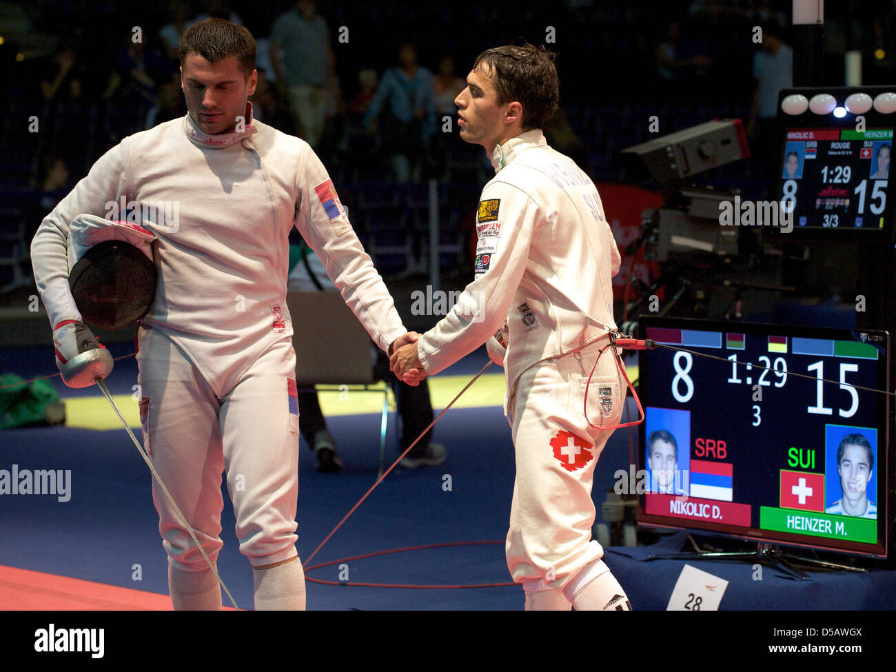 Swiss fencer Max Heinzer (R) shakes hands with Serbian fencer Danilo ...