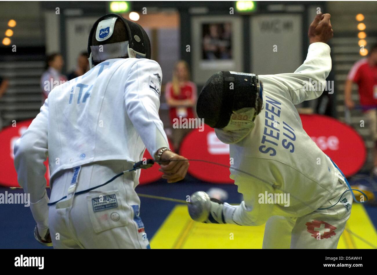 Swiss fencer Benjamin Steffen (R) leaps forward with his epee in the ...