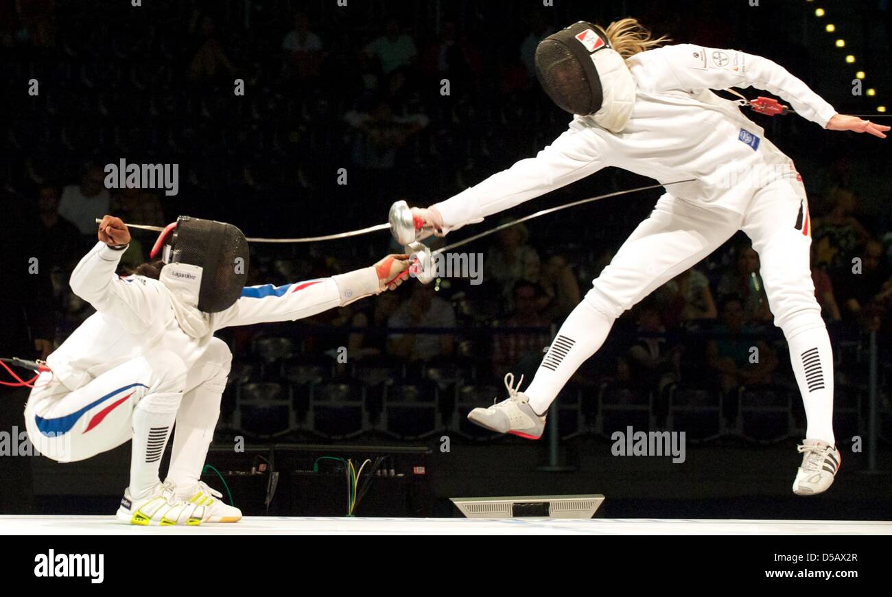 The German epee fencer Britta Heidemann (R) fights against against ...