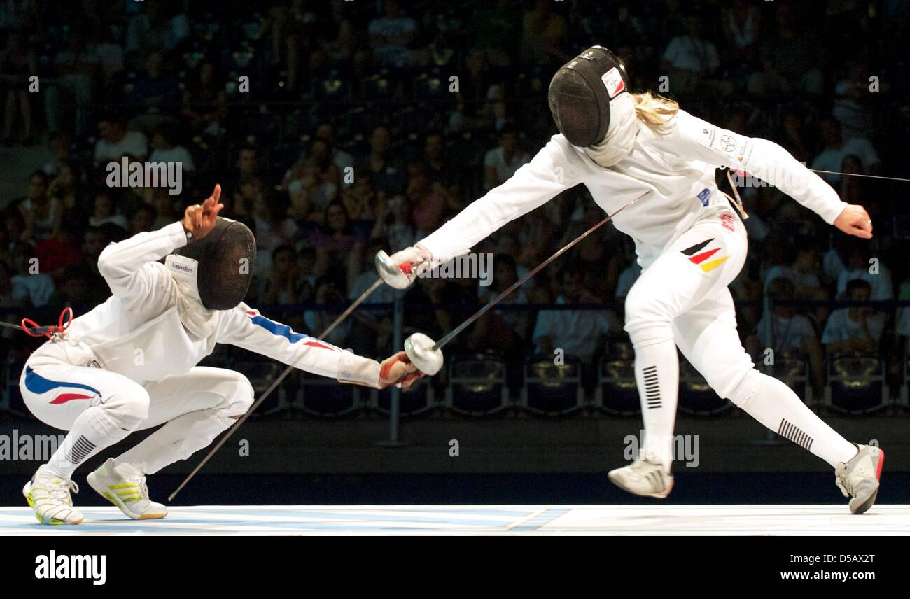 The German epee fencer Britta Heidemann (R) fights against against ...