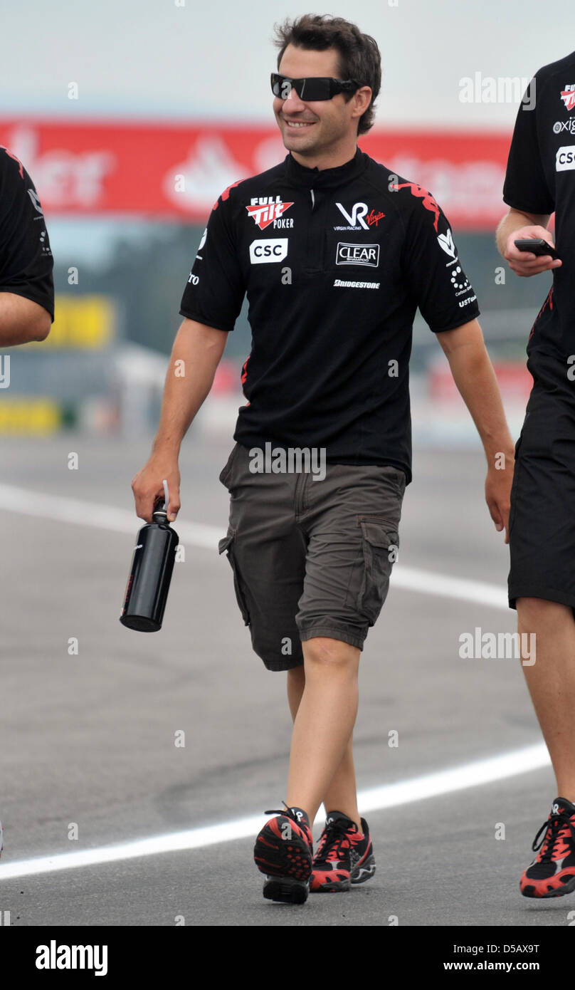 German Formula One racedriver Timo Glock (Team Virgin) walks across the ...