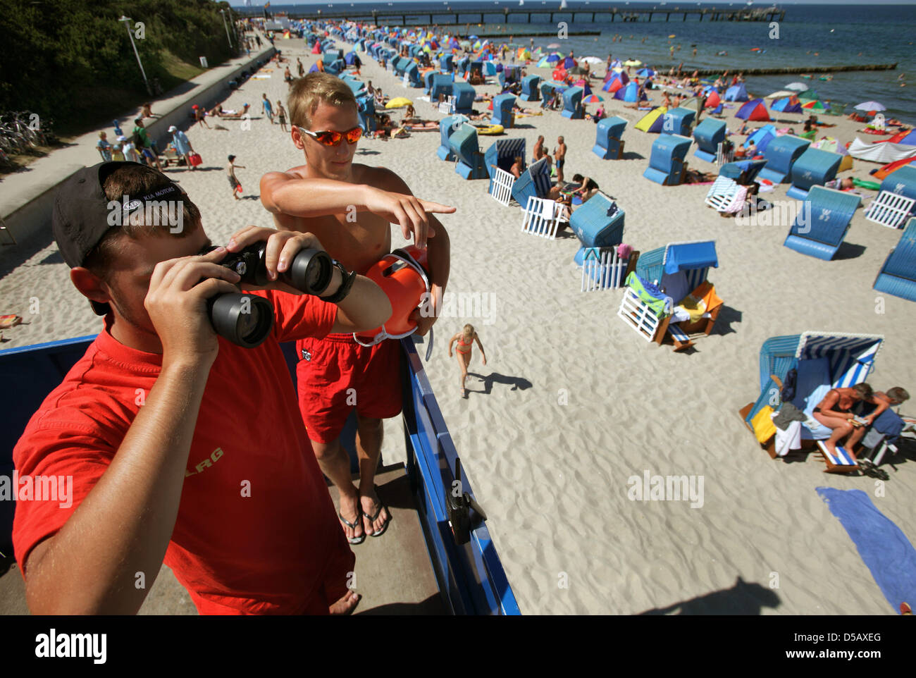 Lifeguards of German Lifeguard Association (DLRG) at the beach of ...