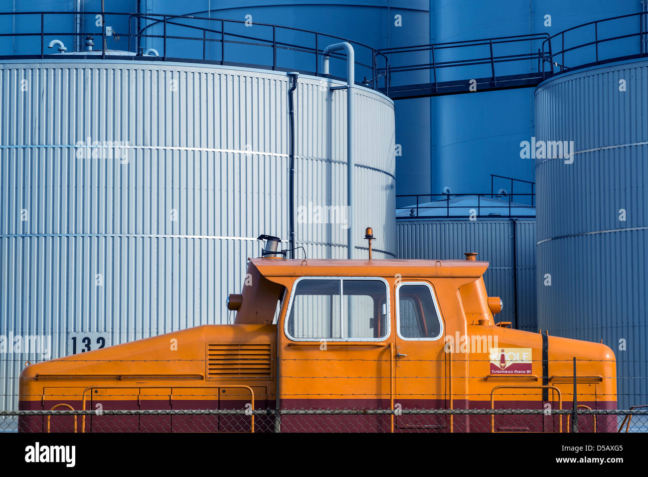 Diesel locomotive in front of an oil storage facility. Europoort ...