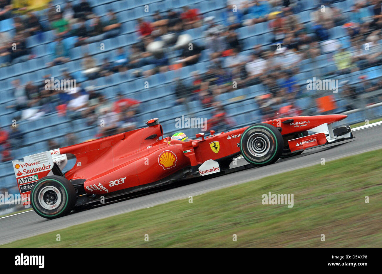 Brazilian driver Felipe Massa of Ferrari passes through the Sachs turn ...