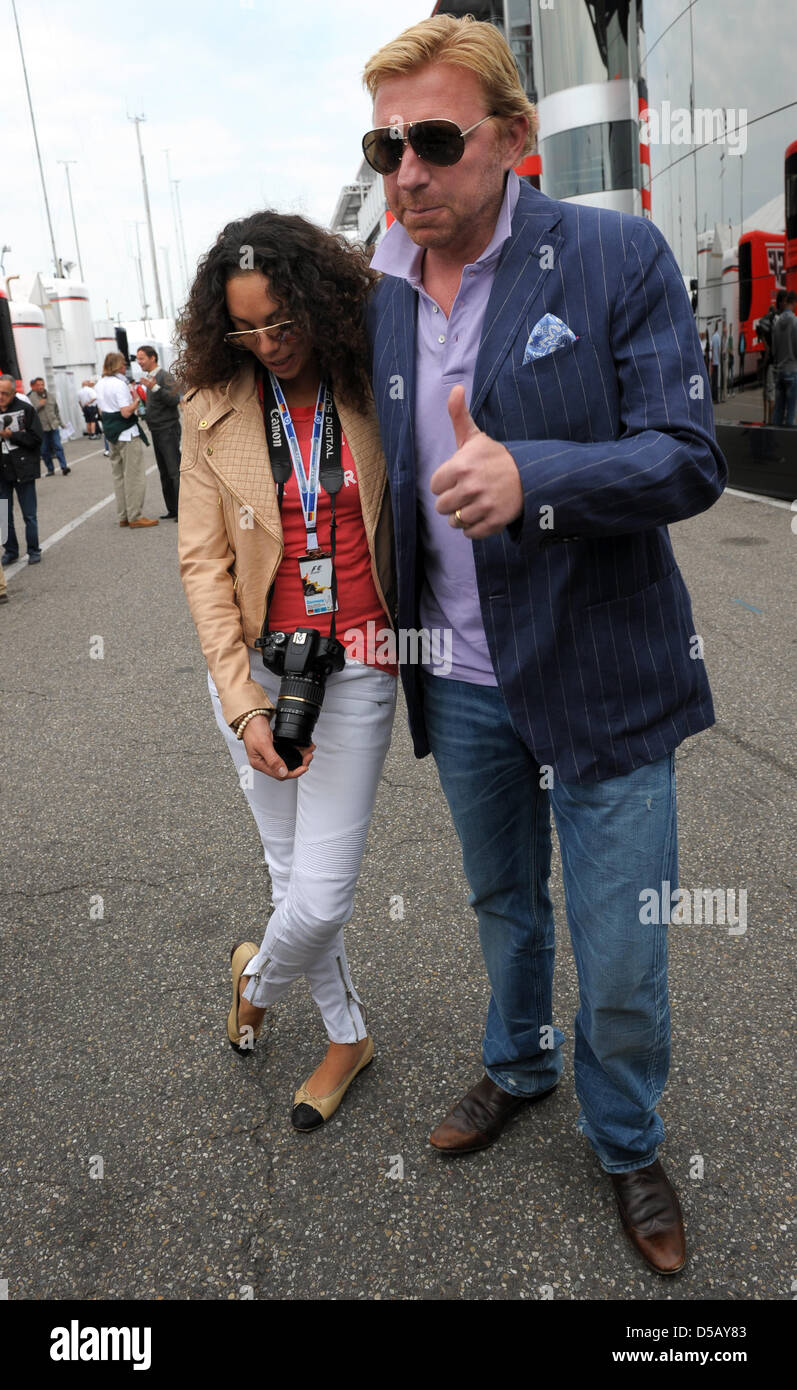 German tennis legend Boris Becker (R) and his wife Lily walk through ...