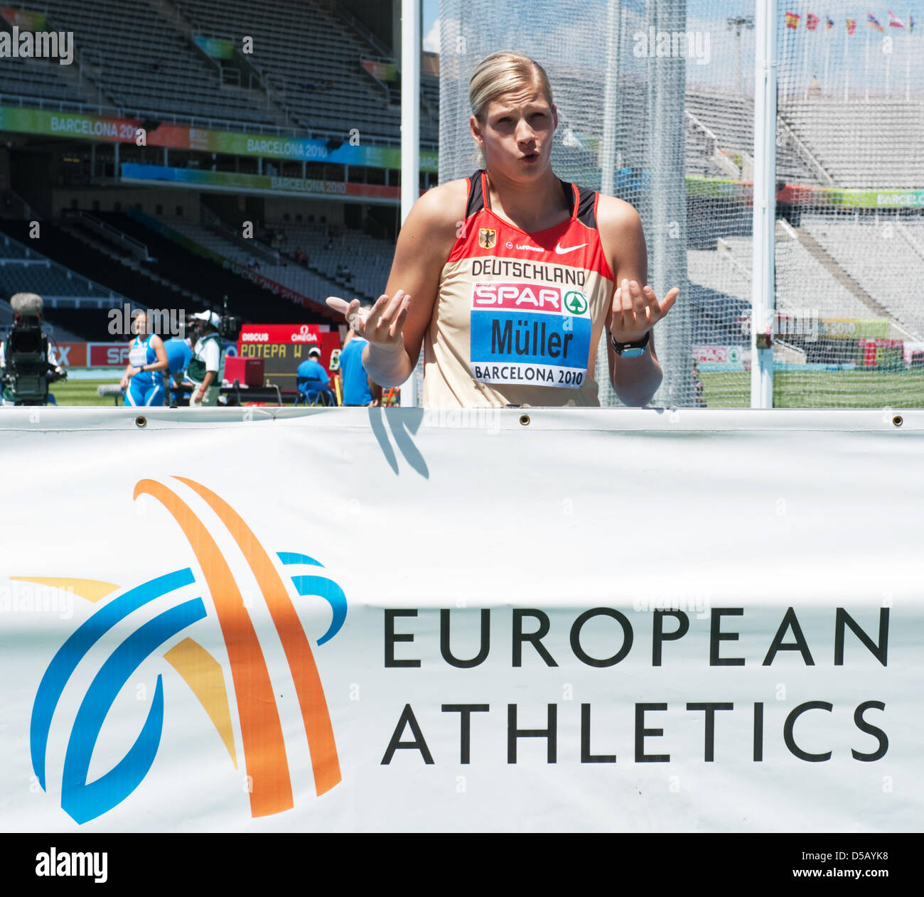 German discus thrower Nadine Mueller talks to her coach at the European ...