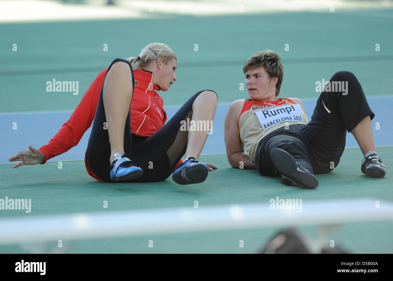 Germans Nadine Mueller (L) and Sabine Rumpf talk before their last ...